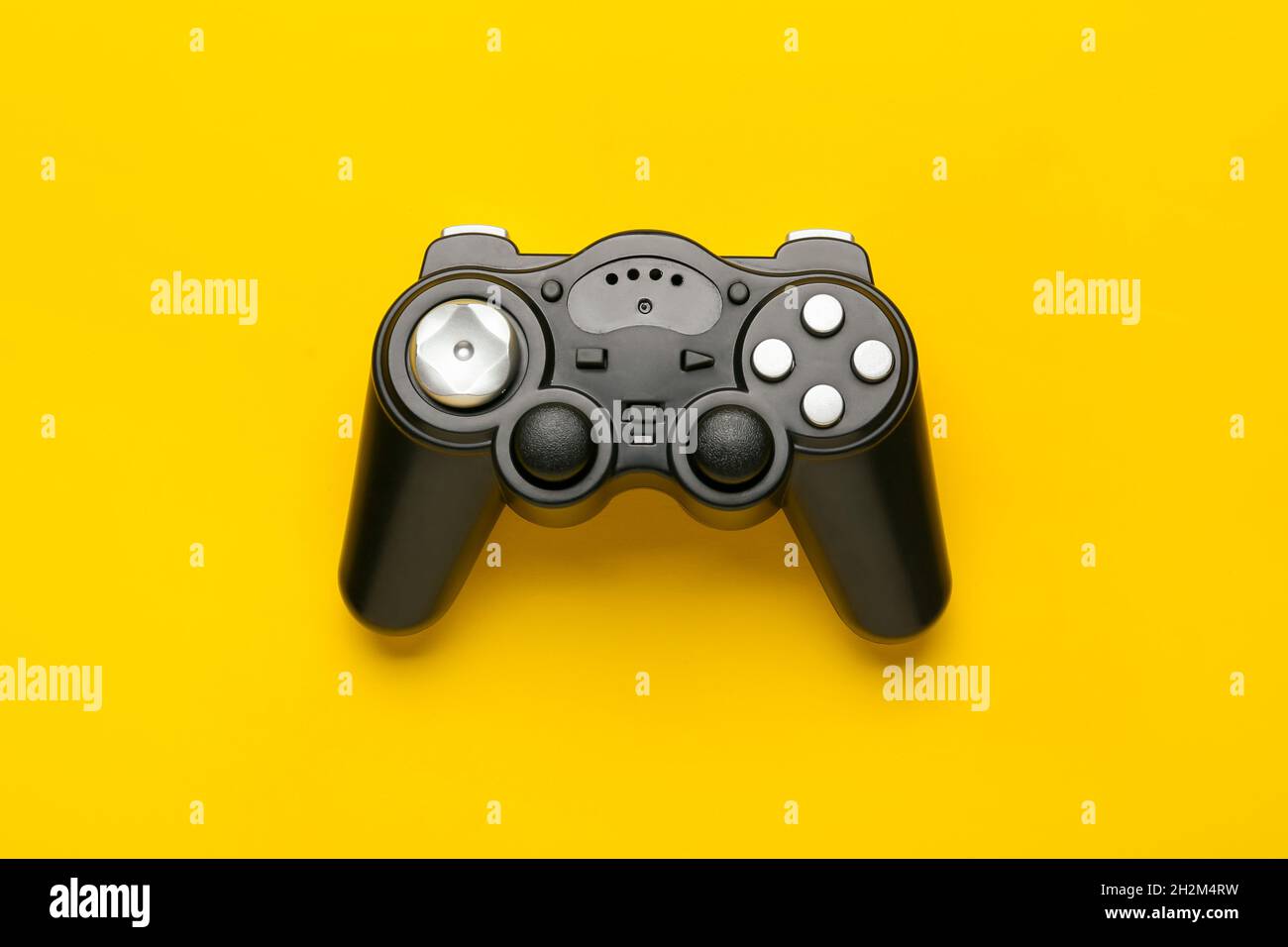 Modern joystick on yellow background Stock Photo - Alamy