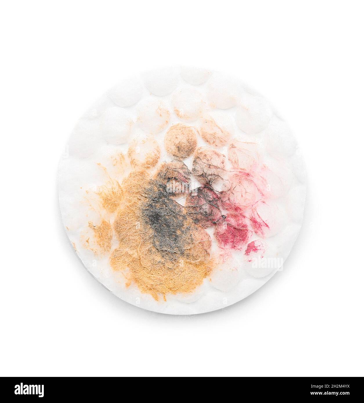 Used cotton pad on white background Stock Photo - Alamy