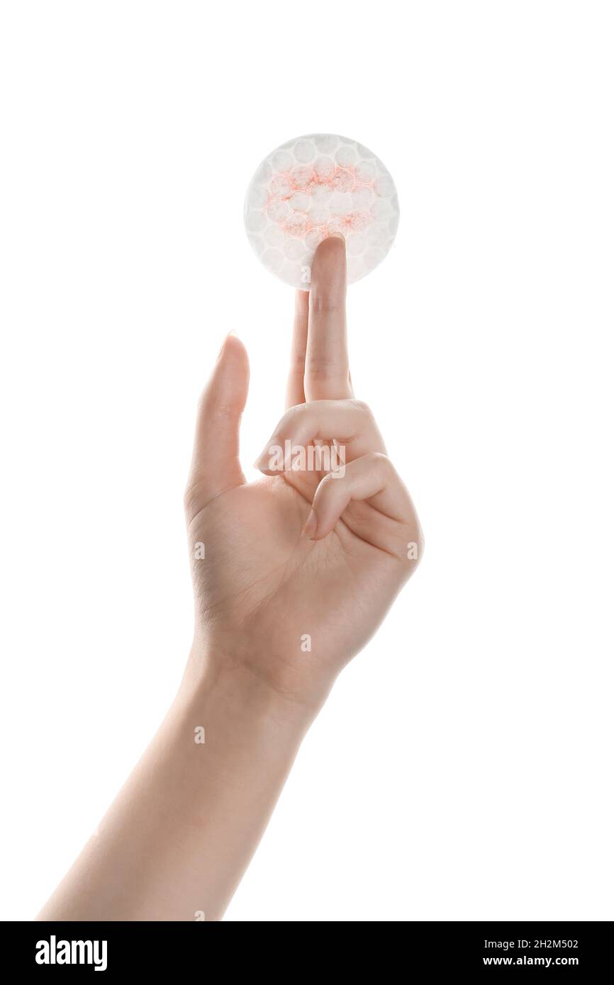 Female hand holding dirty cotton pad on white background Stock Photo ...