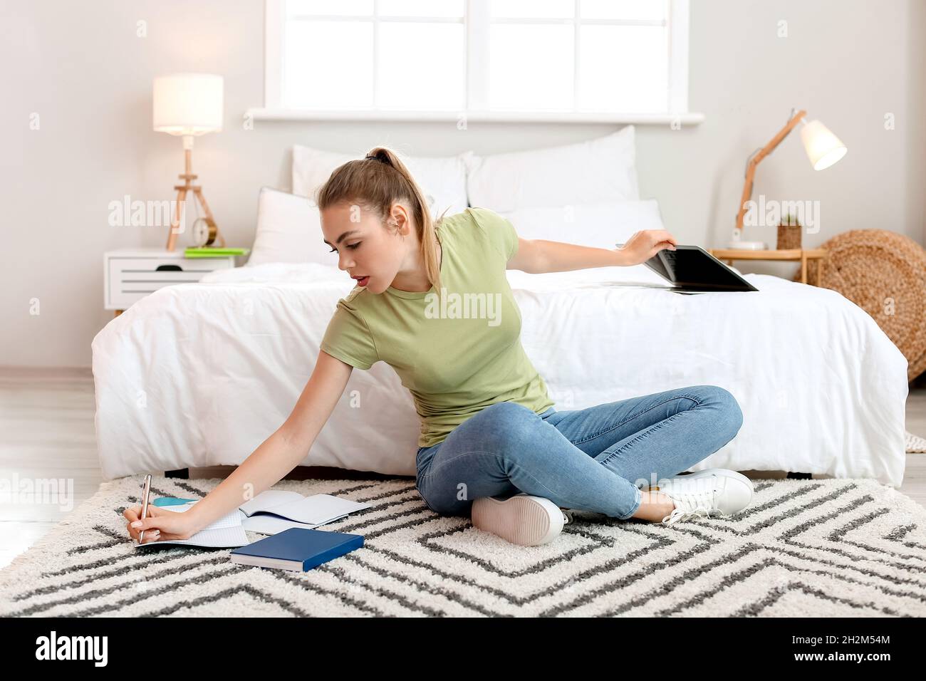 Female student preparing for exam at home Stock Photo - Alamy