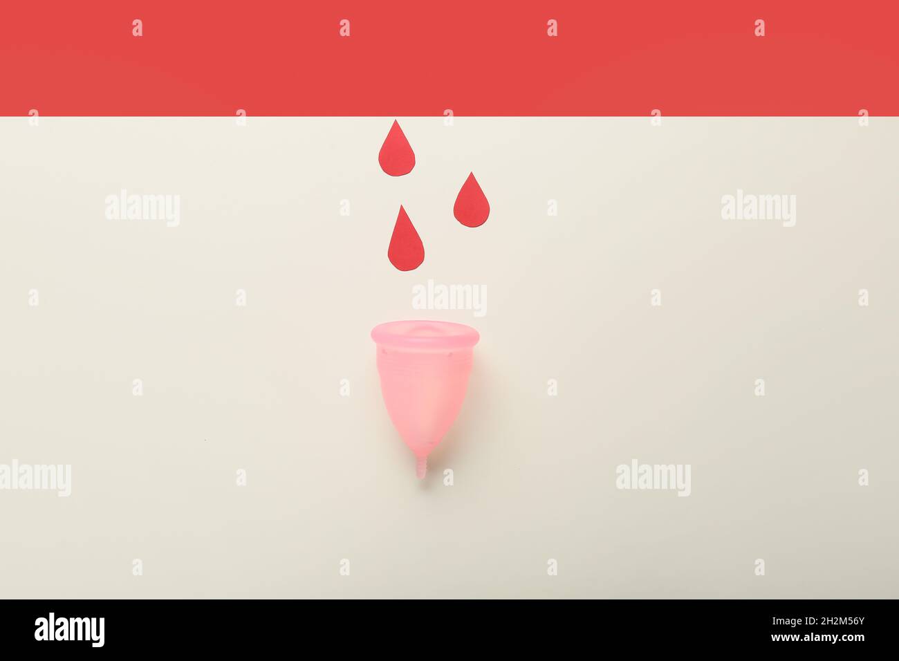 Composition with menstrual cup and blood drops on color background ...