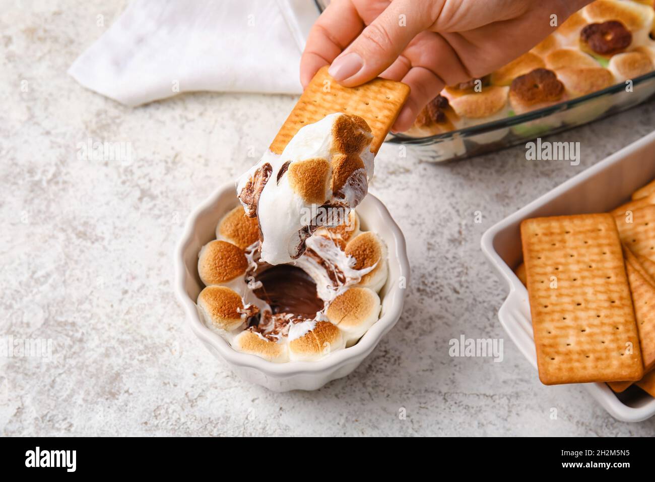 Woman eating smores hi-res stock photography and images - Alamy