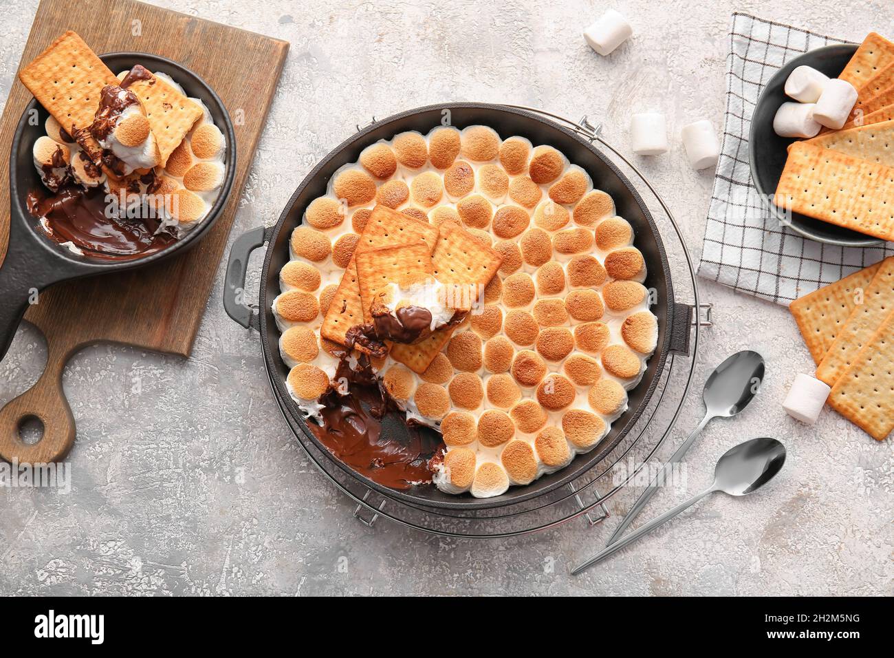 Composition with tasty S'mores dip on grey background Stock Photo - Alamy