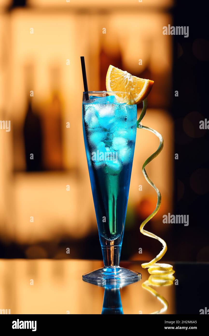 Glass of Blue Lagoon cocktail on table in bar Stock Photo - Alamy