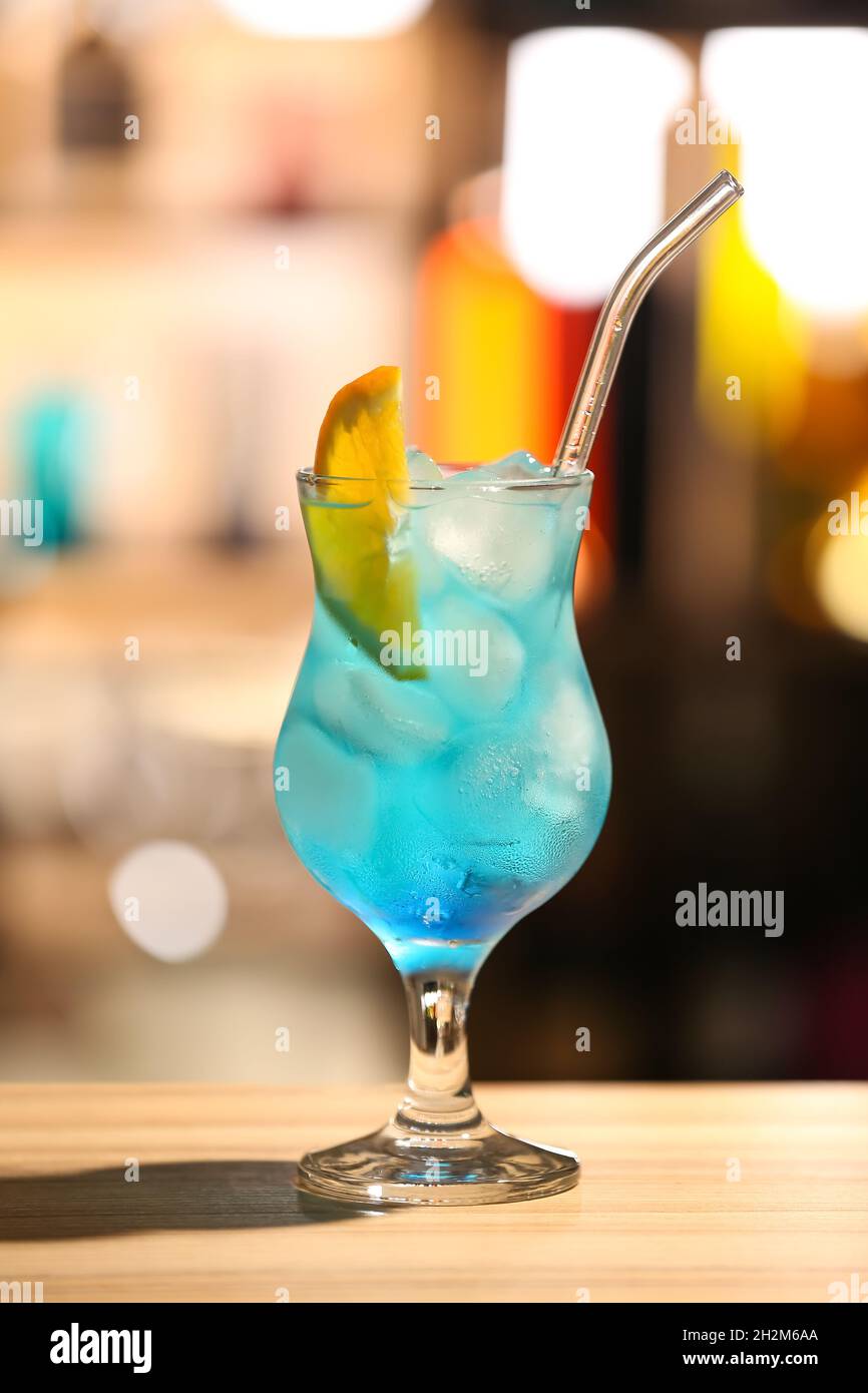 Glass of Blue Lagoon cocktail on table in bar Stock Photo - Alamy