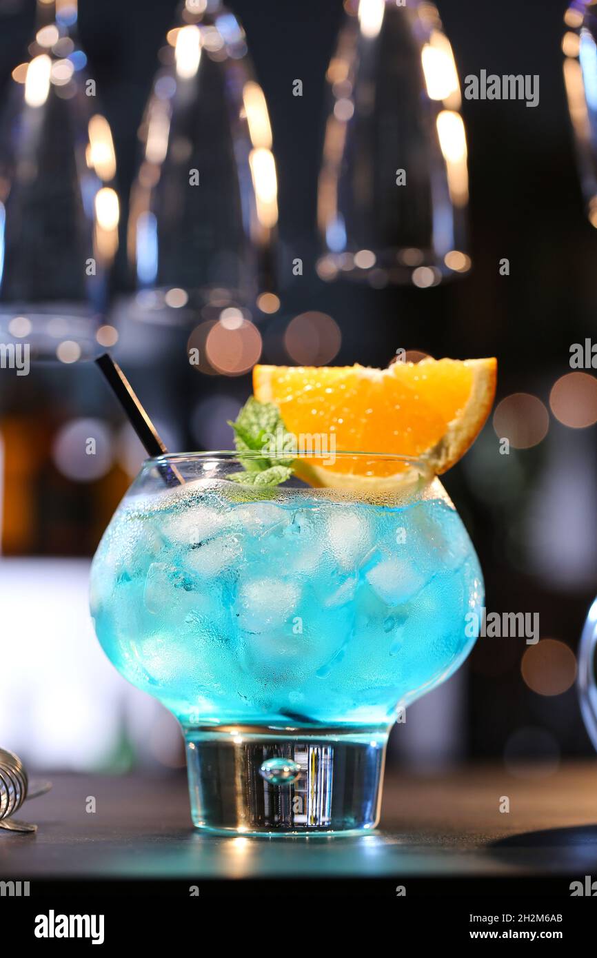 Glass of Blue Lagoon cocktail on table in bar Stock Photo - Alamy
