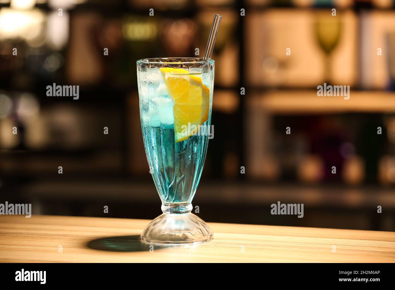 Glass of Blue Lagoon cocktail on table in bar Stock Photo - Alamy