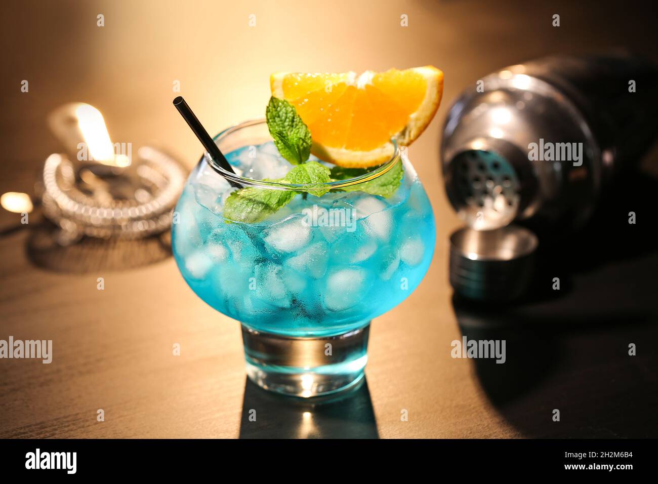 Glass of Blue Lagoon cocktail on table in bar Stock Photo - Alamy