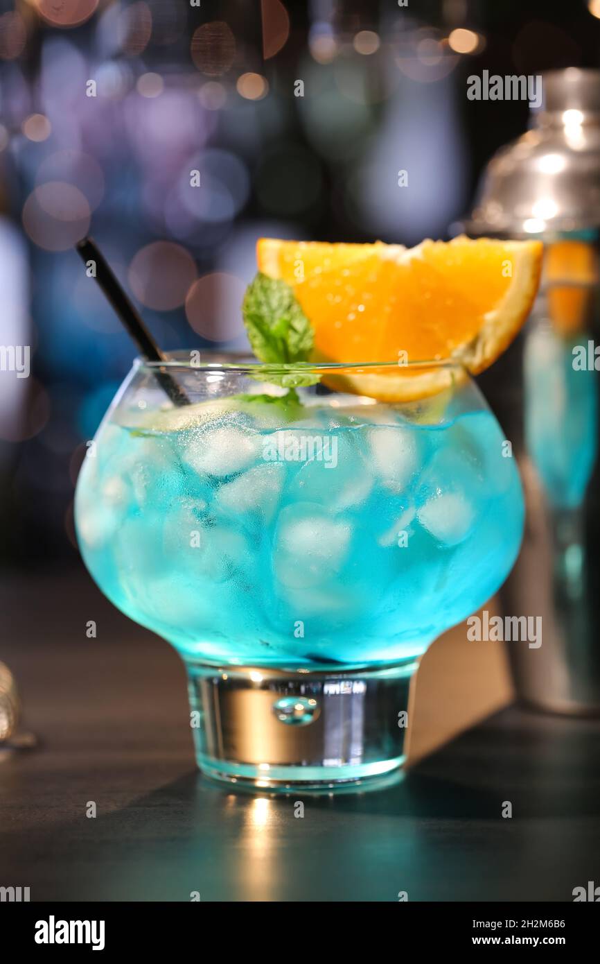 Glass of Blue Lagoon cocktail on table in bar Stock Photo - Alamy