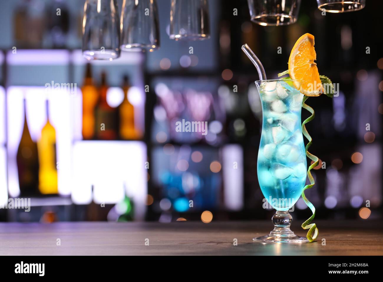 Glass of Blue Lagoon cocktail on table in bar Stock Photo - Alamy
