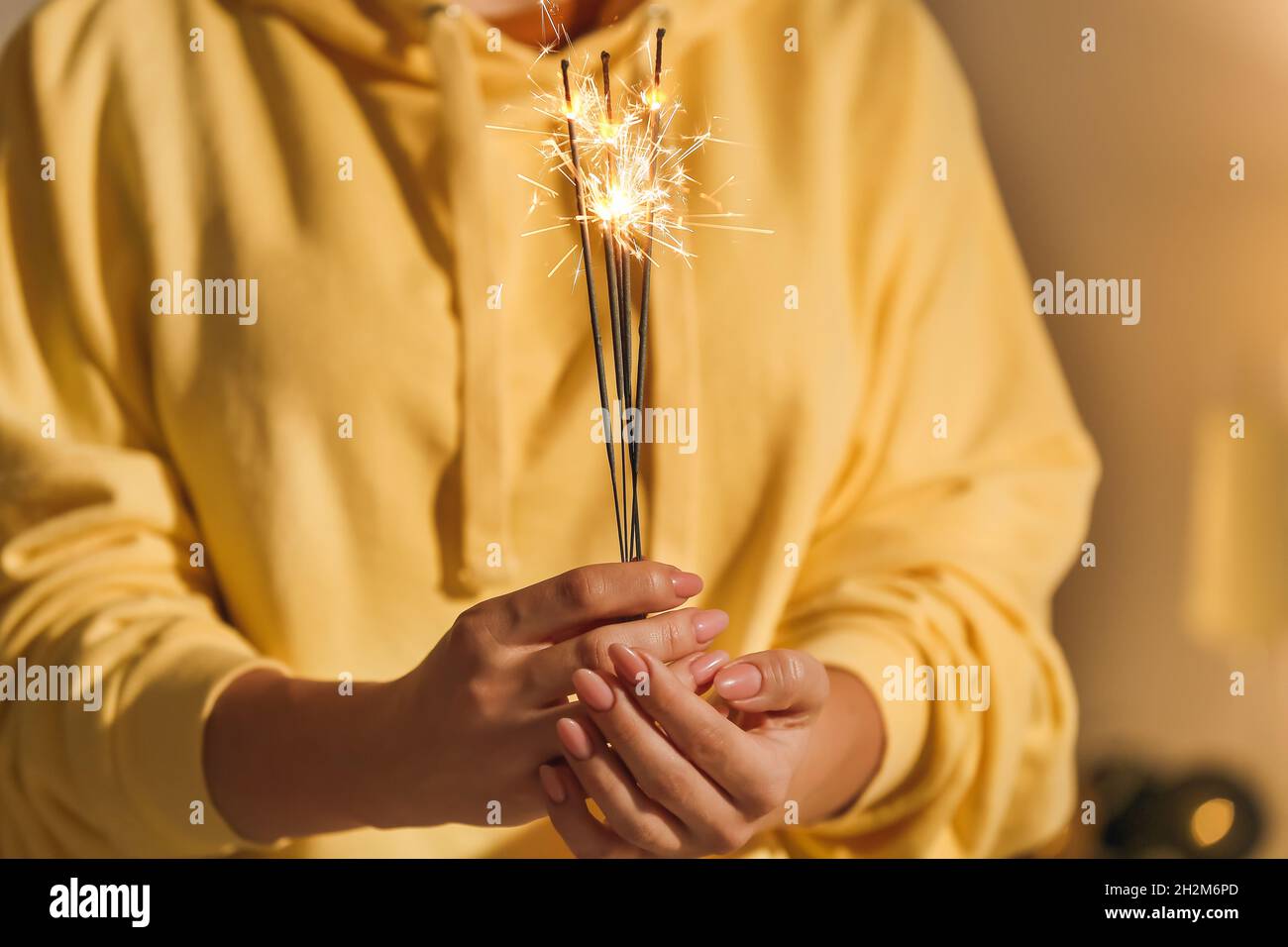 Woman sparkler in room hi-res stock photography and images - Alamy