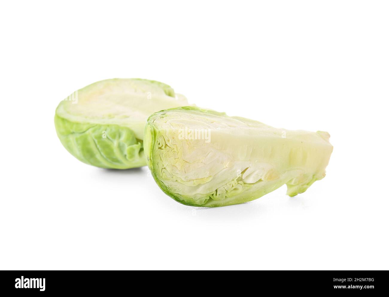 Cut raw Brussels cabbage on white background Stock Photo - Alamy