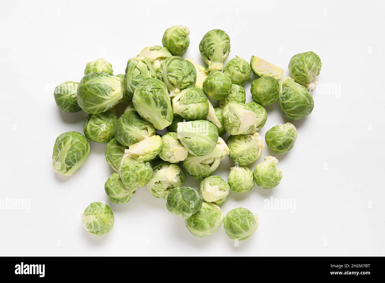 Pile of fresh raw Brussels cabbage on white background Stock Photo - Alamy