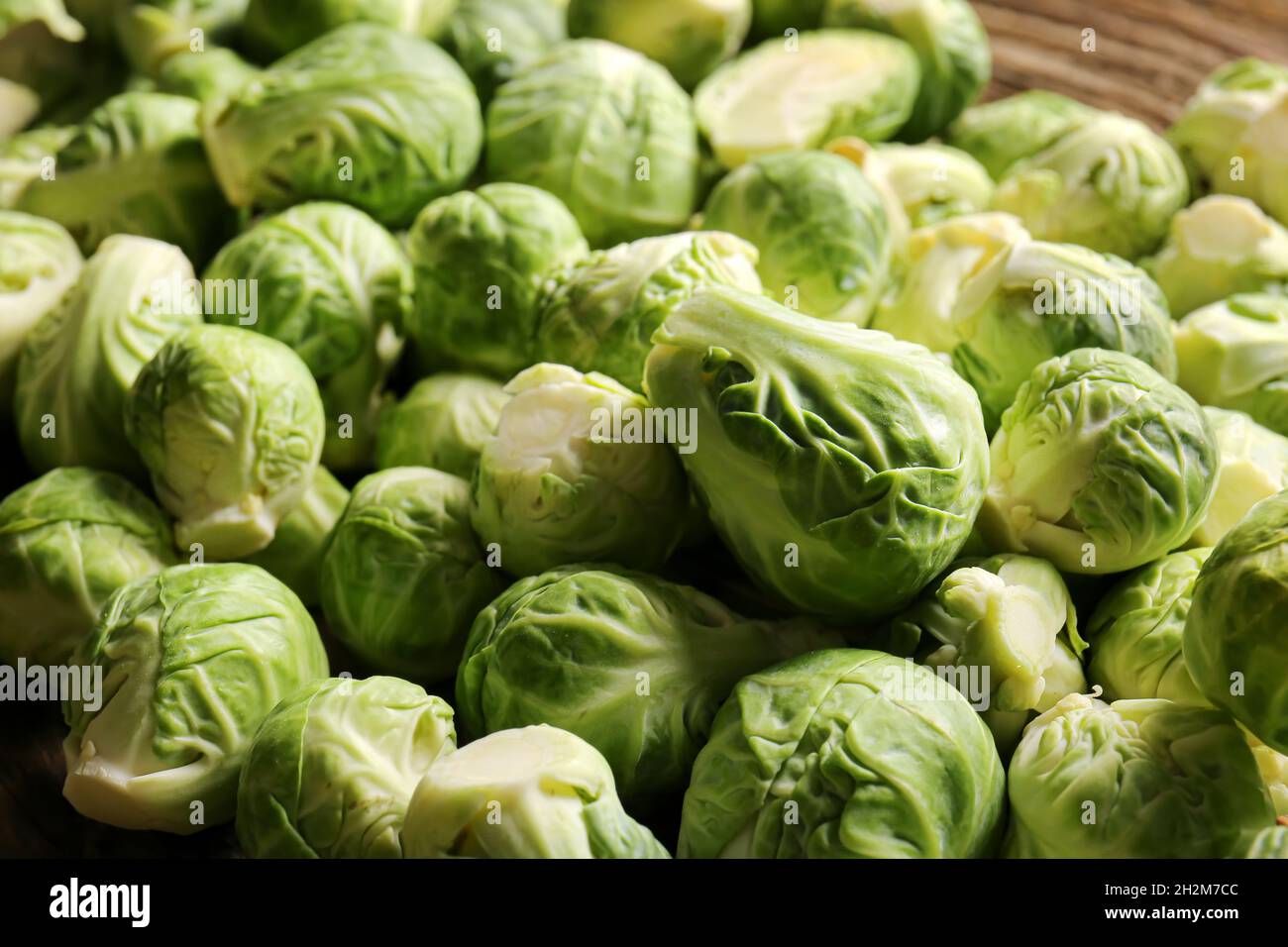 Fresh raw Brussels cabbage on table, closeup Stock Photo - Alamy