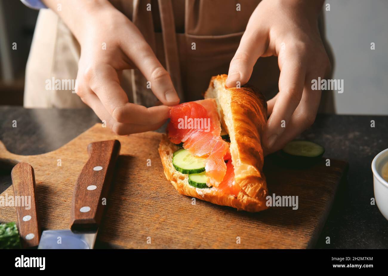 Woman stuffing fish vegetables preparing hi-res stock photography and ...