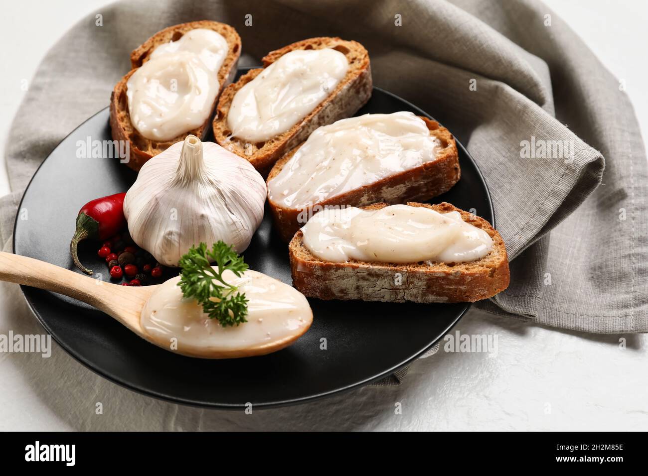 Plate of bread with lard spread on white background Stock Photo - Alamy