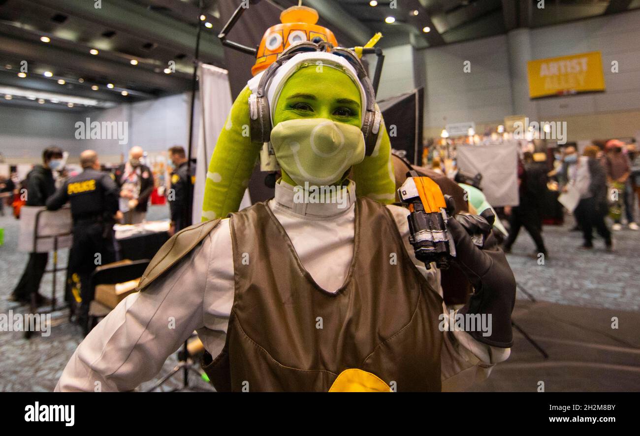 Toronto, Canada. 22nd Oct, 2021. A cosplayer poses for photos during ...