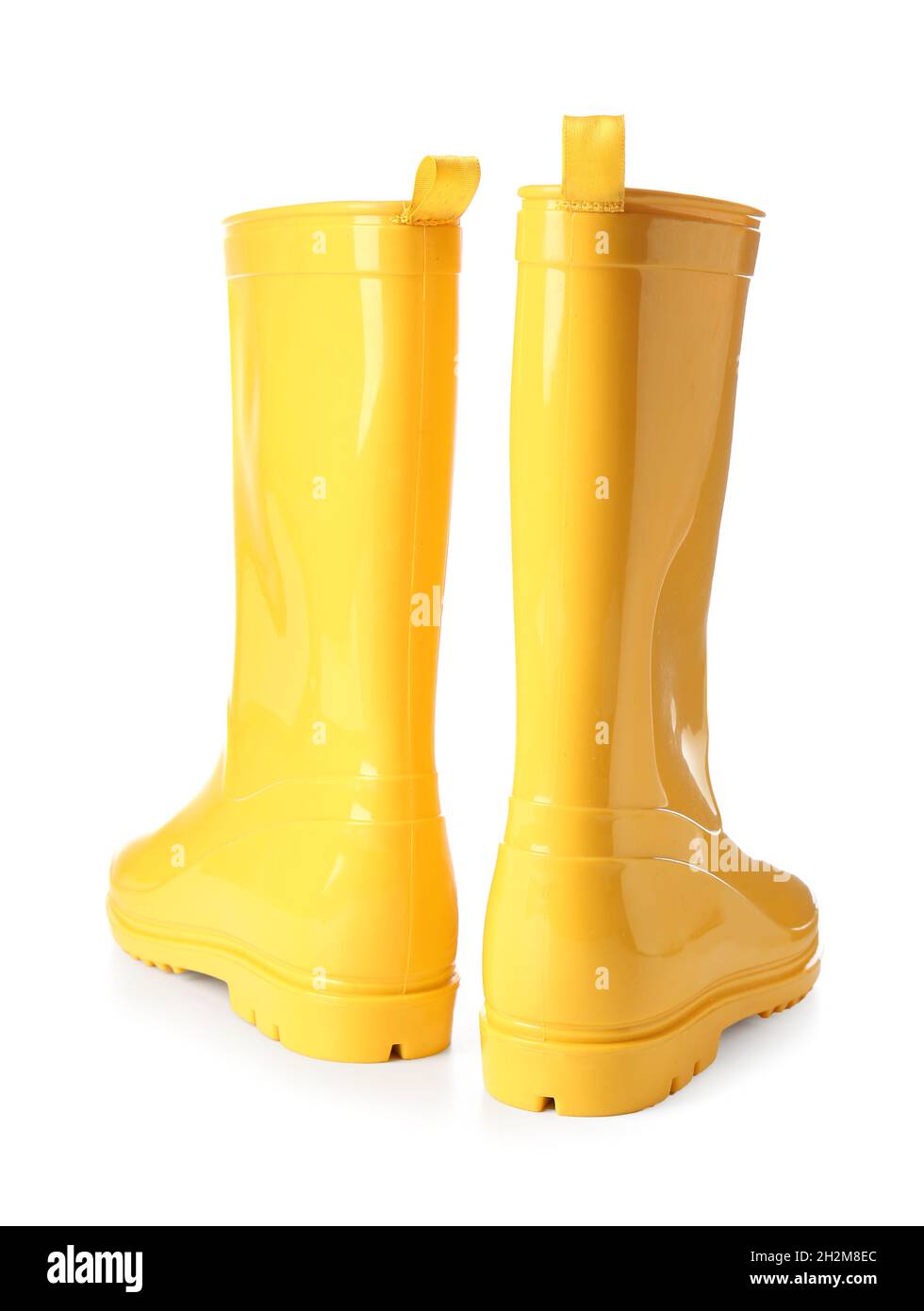 Yellow rubber boots isolated on white background Stock Photo - Alamy