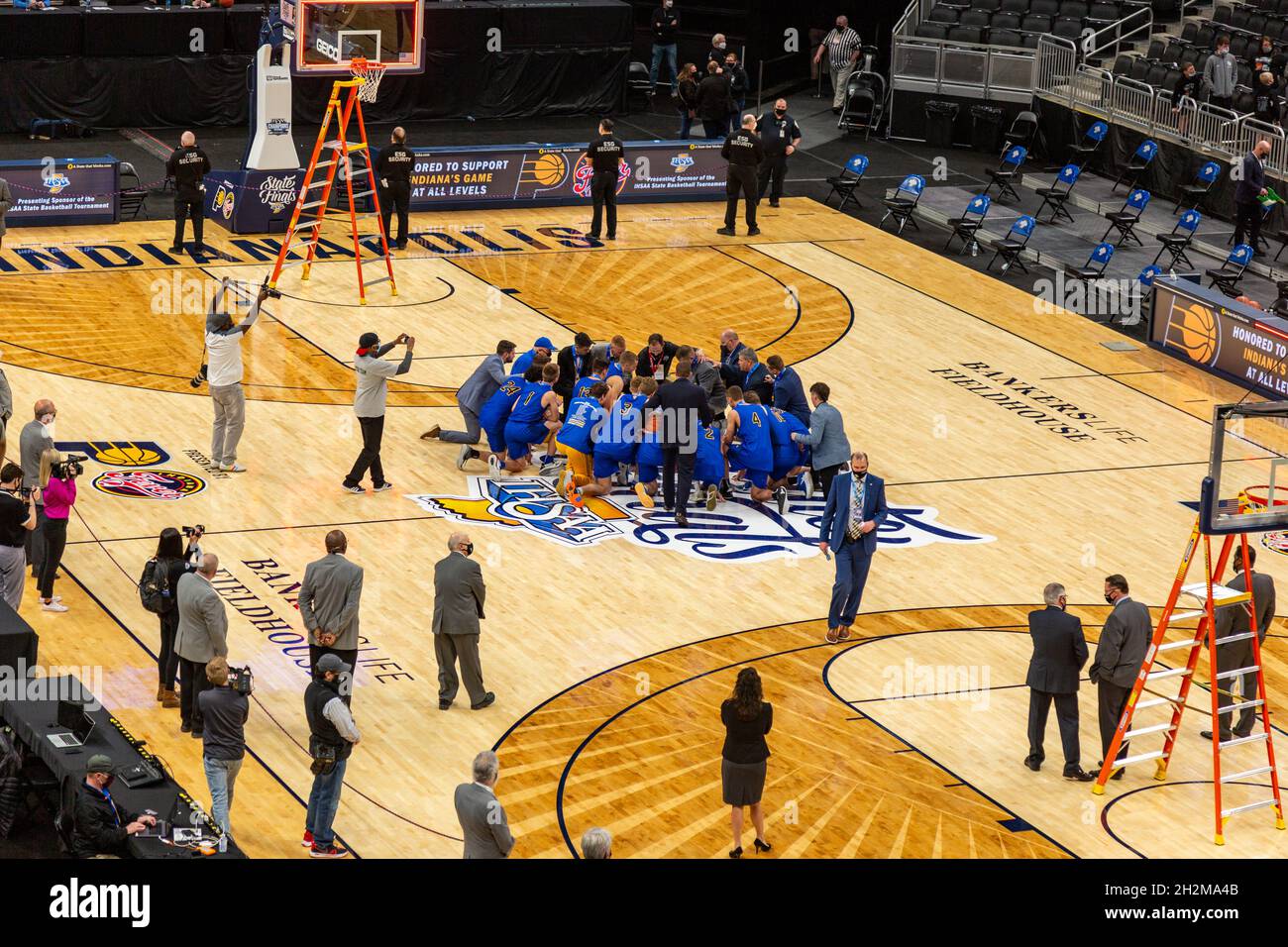 The Blackhawk Christian High School Braves pray at center court after ...