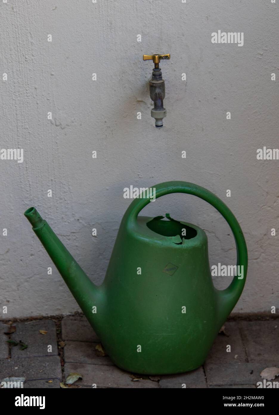 Water tap watering can hi-res stock photography and images - Alamy