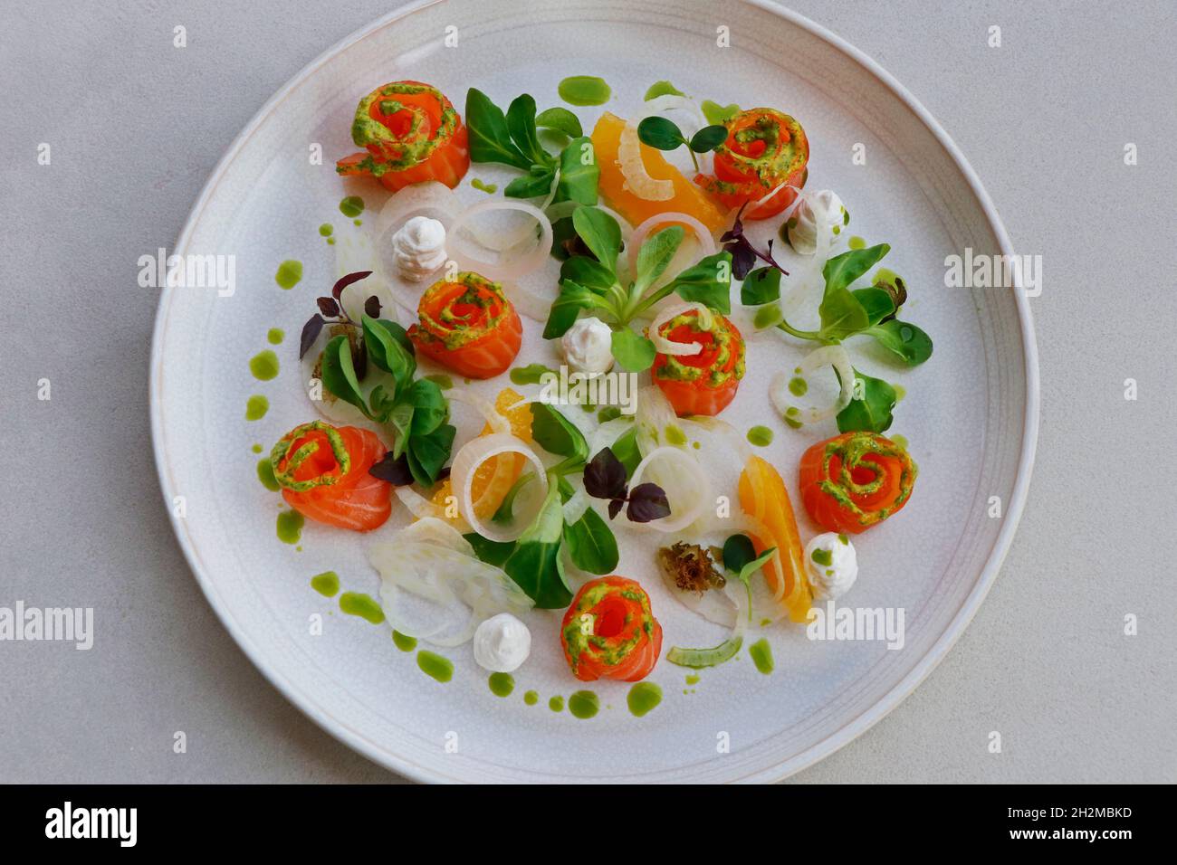 salmon gravlax, salt and sugar cured fresh salmon in a serving plate ...