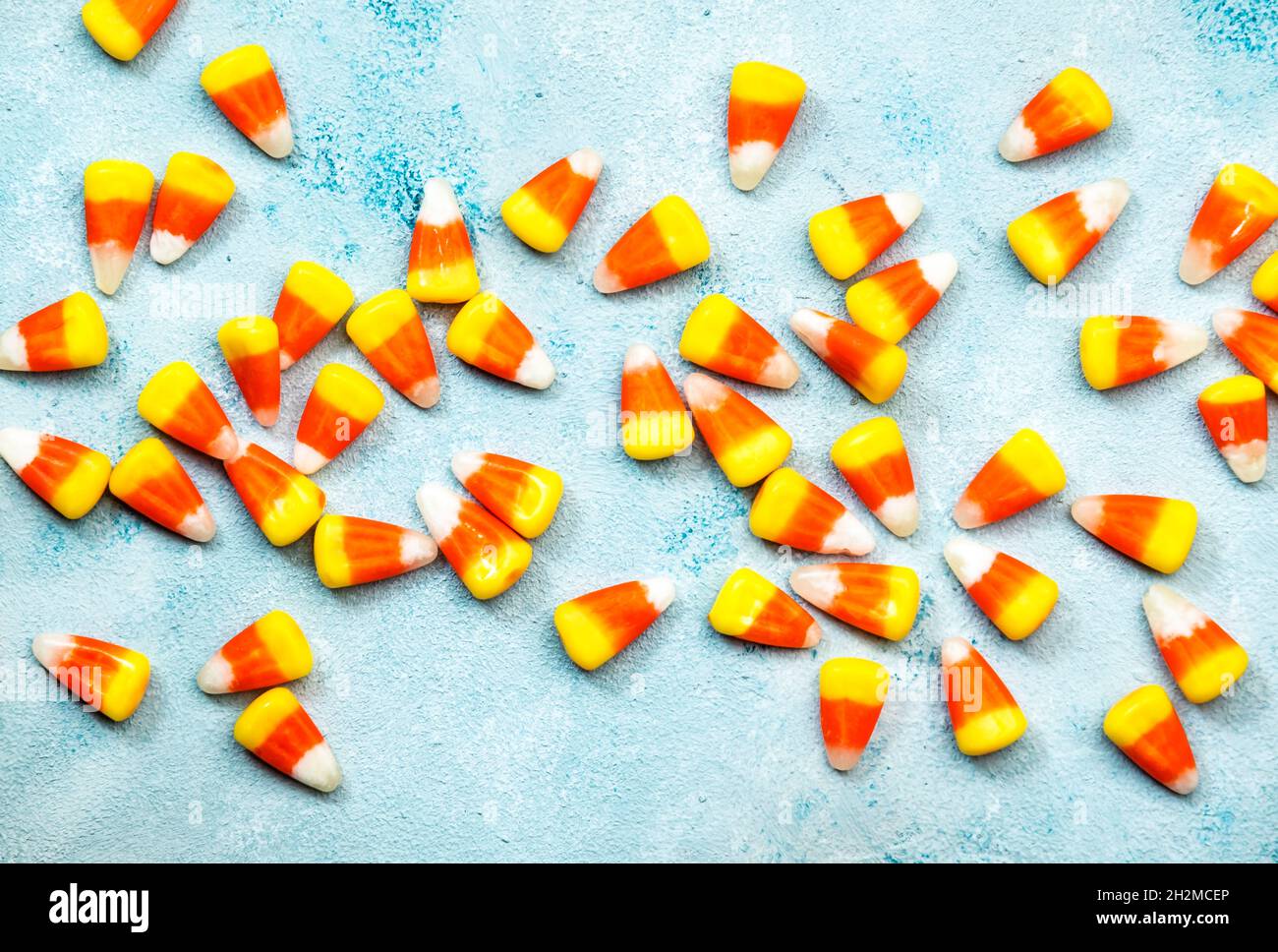 Halloween candy corn banner on blue baclground. Top view with copy ...