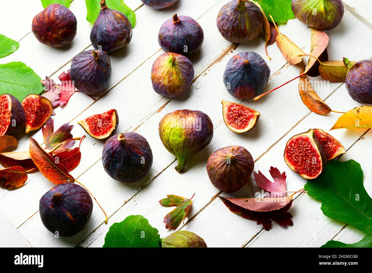 Fig fruits.Tropical fruits.Fresh whole and sliced fig on white ...