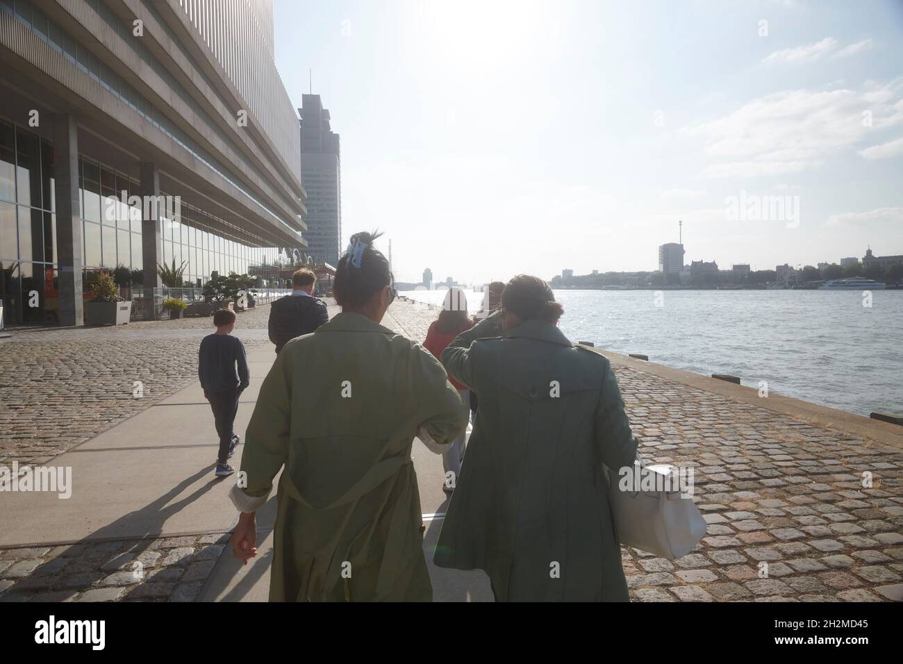 Asian family enjoying a walk along the river Maas in Rotterdam Stock ...