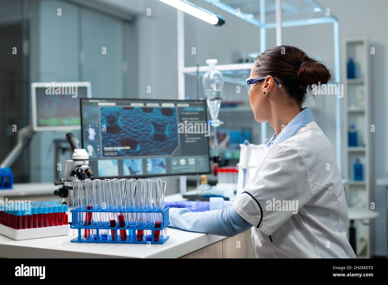 Scientific microbiologist doctor analyzing medical disease developing ...