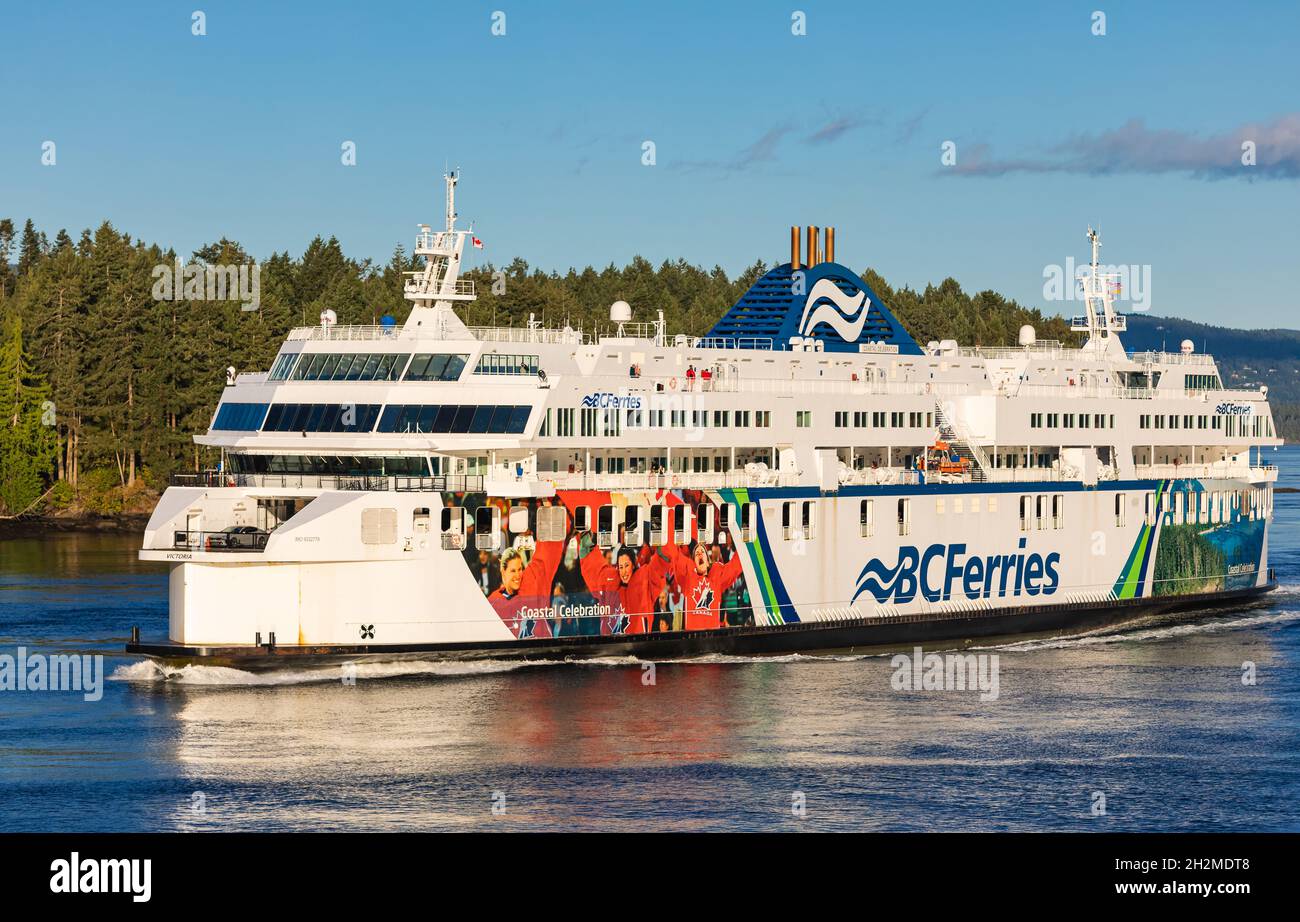 Ferry in front of Coast Mountains. BC Ferry crossing the strait in gulf ...