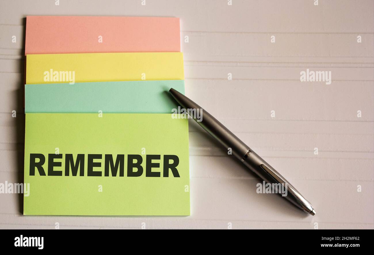 on the sticker remember text and pen on a white background Stock Photo ...