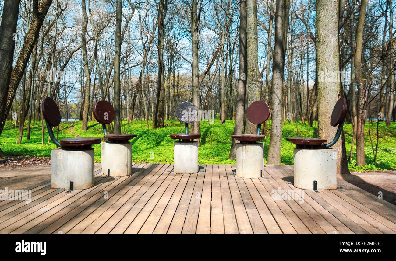 Unusual chairs in a spring park in Europe. Nice sunny weather Stock ...
