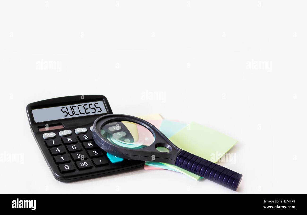 Success text on a calculator. Business concept on white background ...