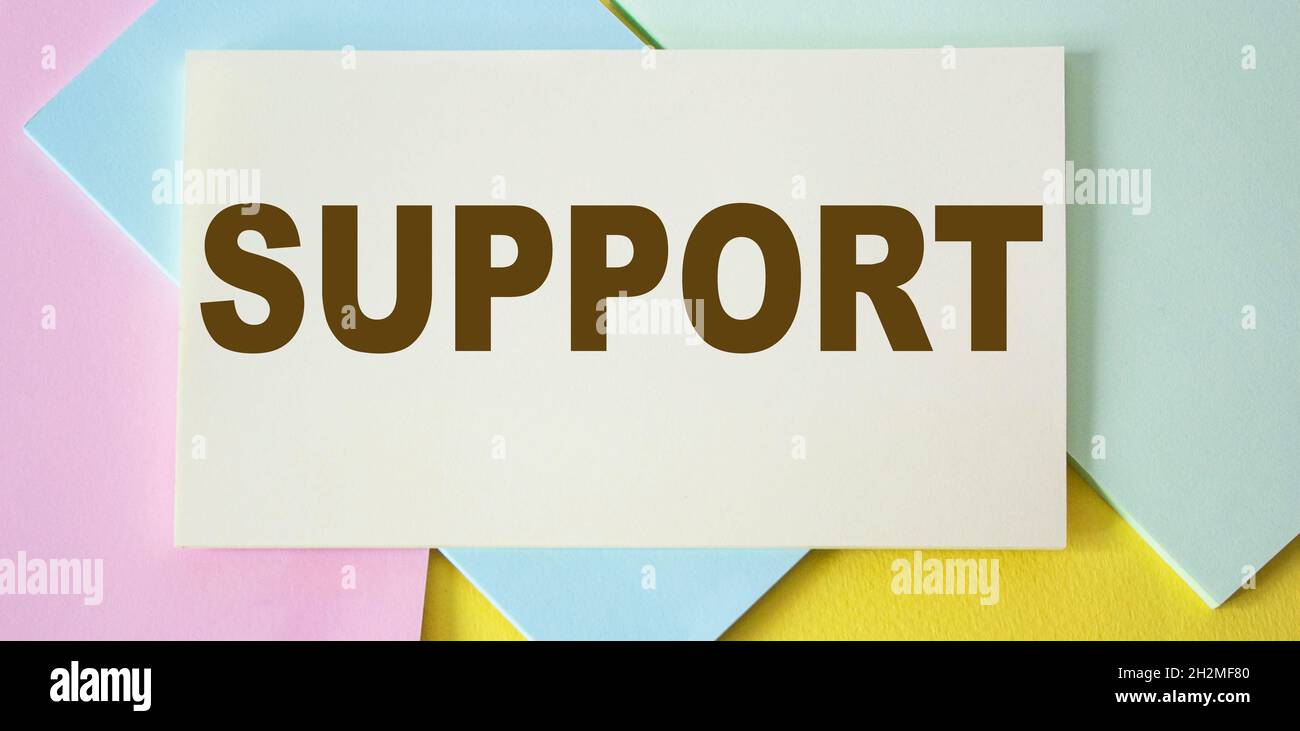 Support text written in color sticker and yellow background Stock Photo ...