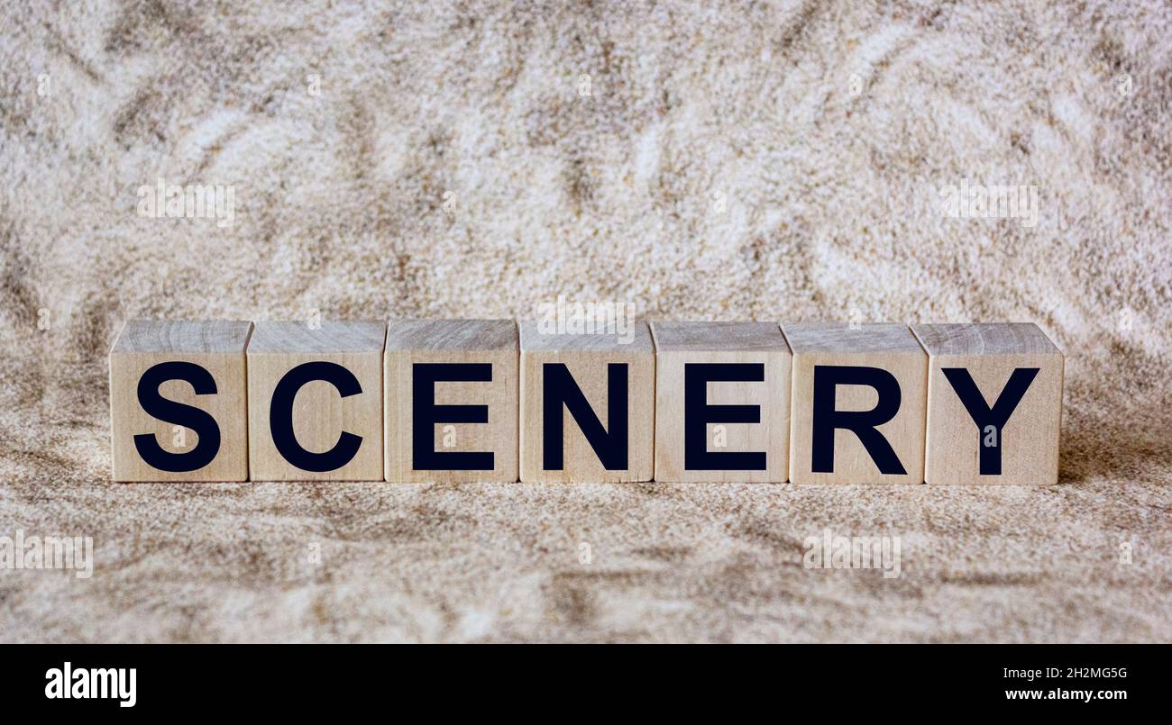 Scenery text written on wooden cubes and sand background Stock Photo ...