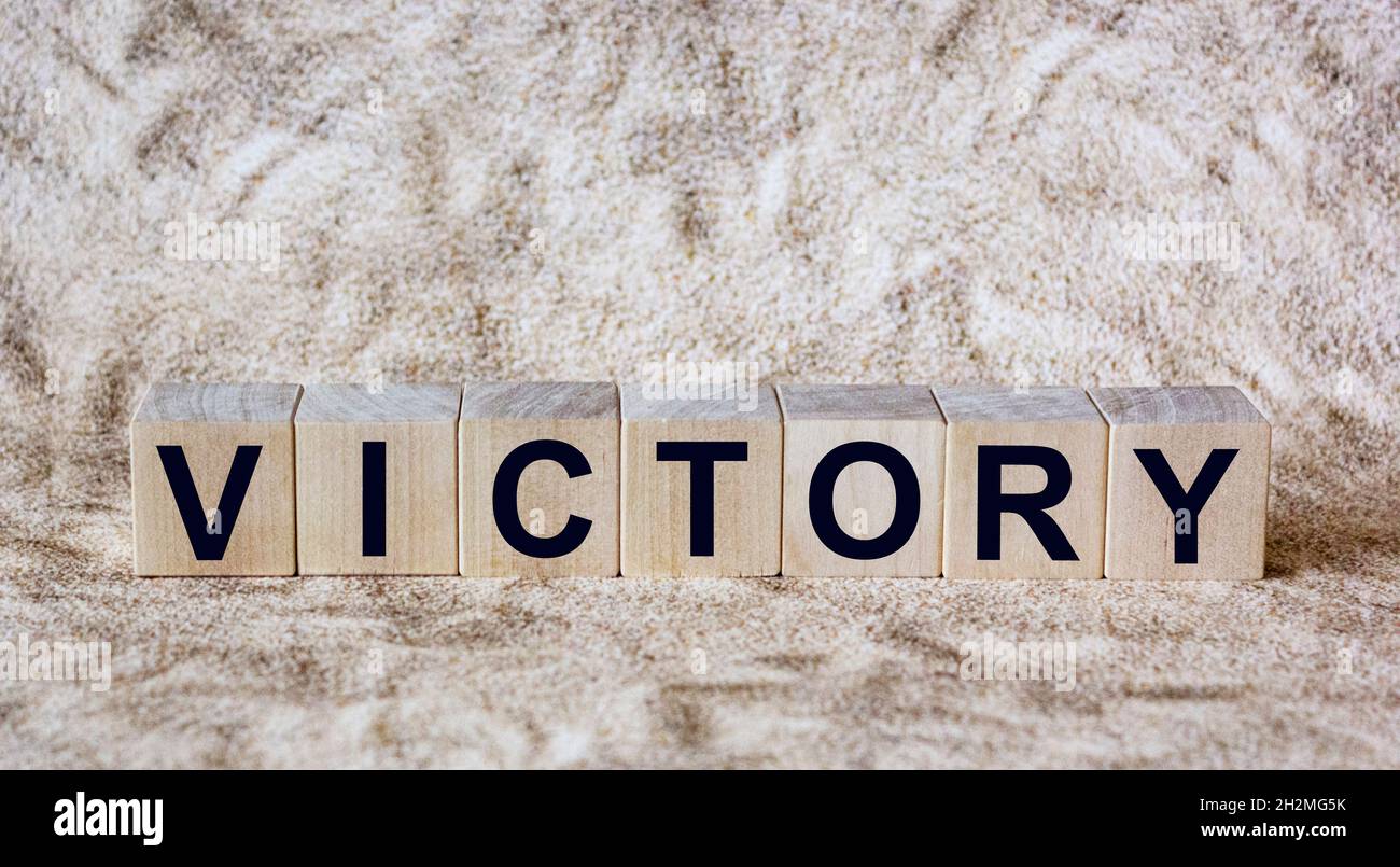 VICTORY word made of brown wooden letters on light table Stock Photo ...