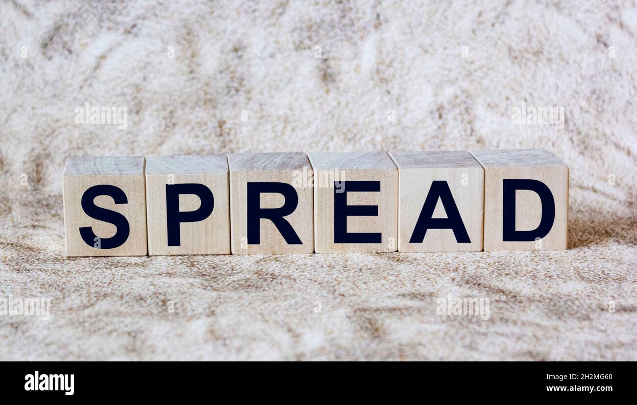 spread text made of wooden cube on White background Stock Photo - Alamy