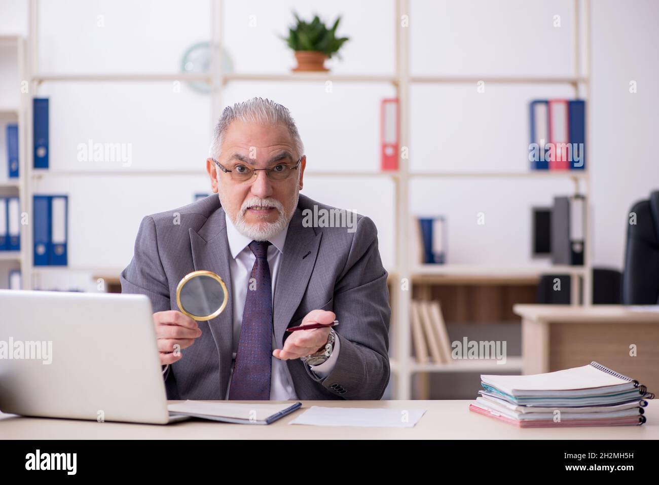 Old auditor working in the office Stock Photo - Alamy
