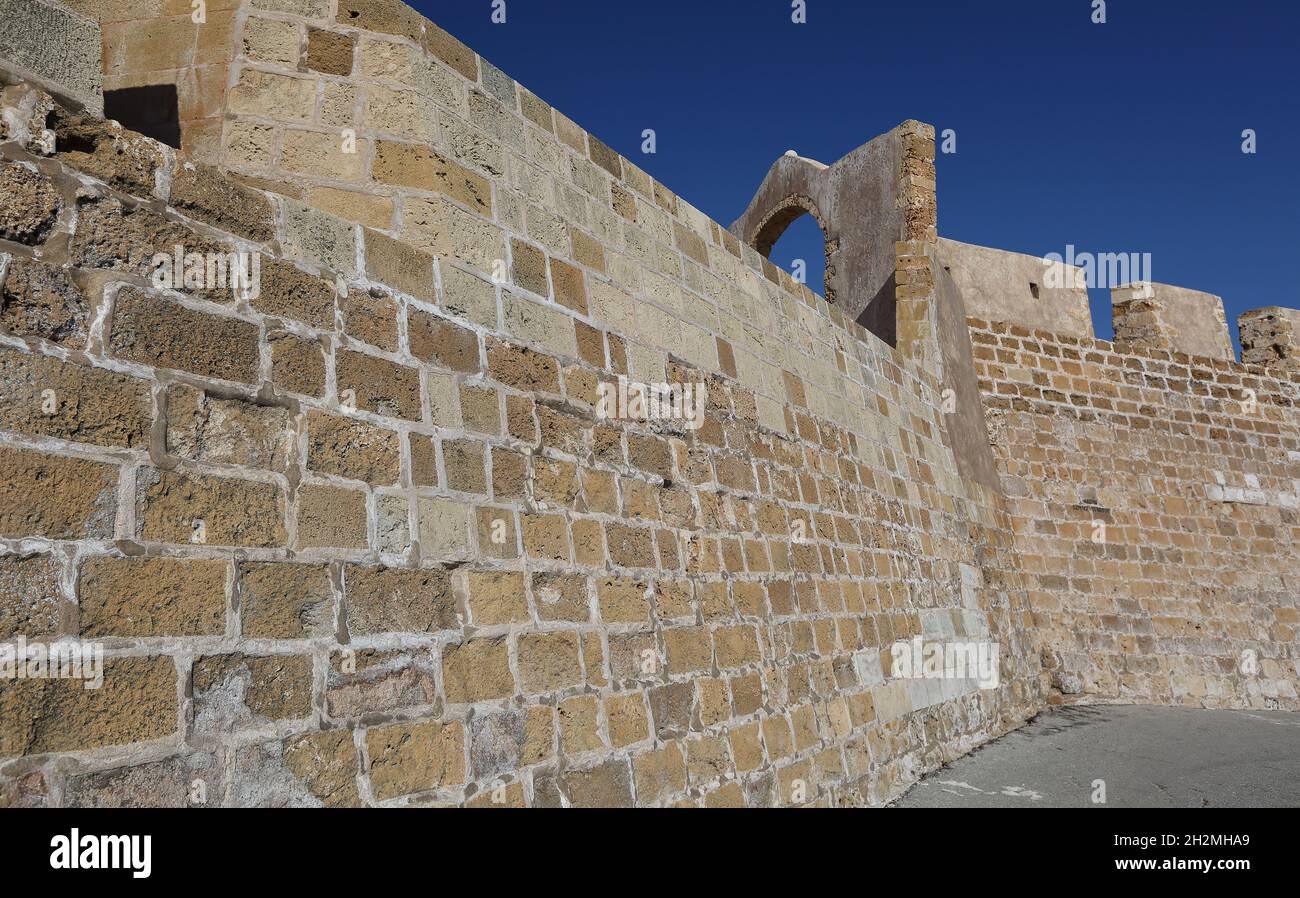 Traditional stony wall against blues sky in Chania, Crete ...