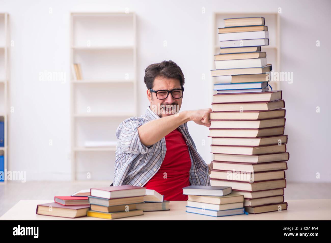 Man destroying book hi-res stock photography and images - Alamy