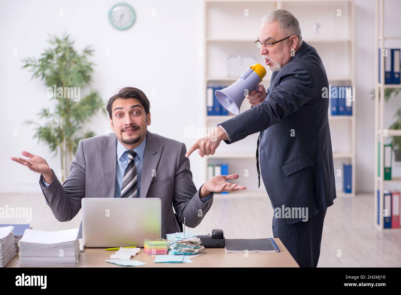 Two employees in bullying concept Stock Photo - Alamy