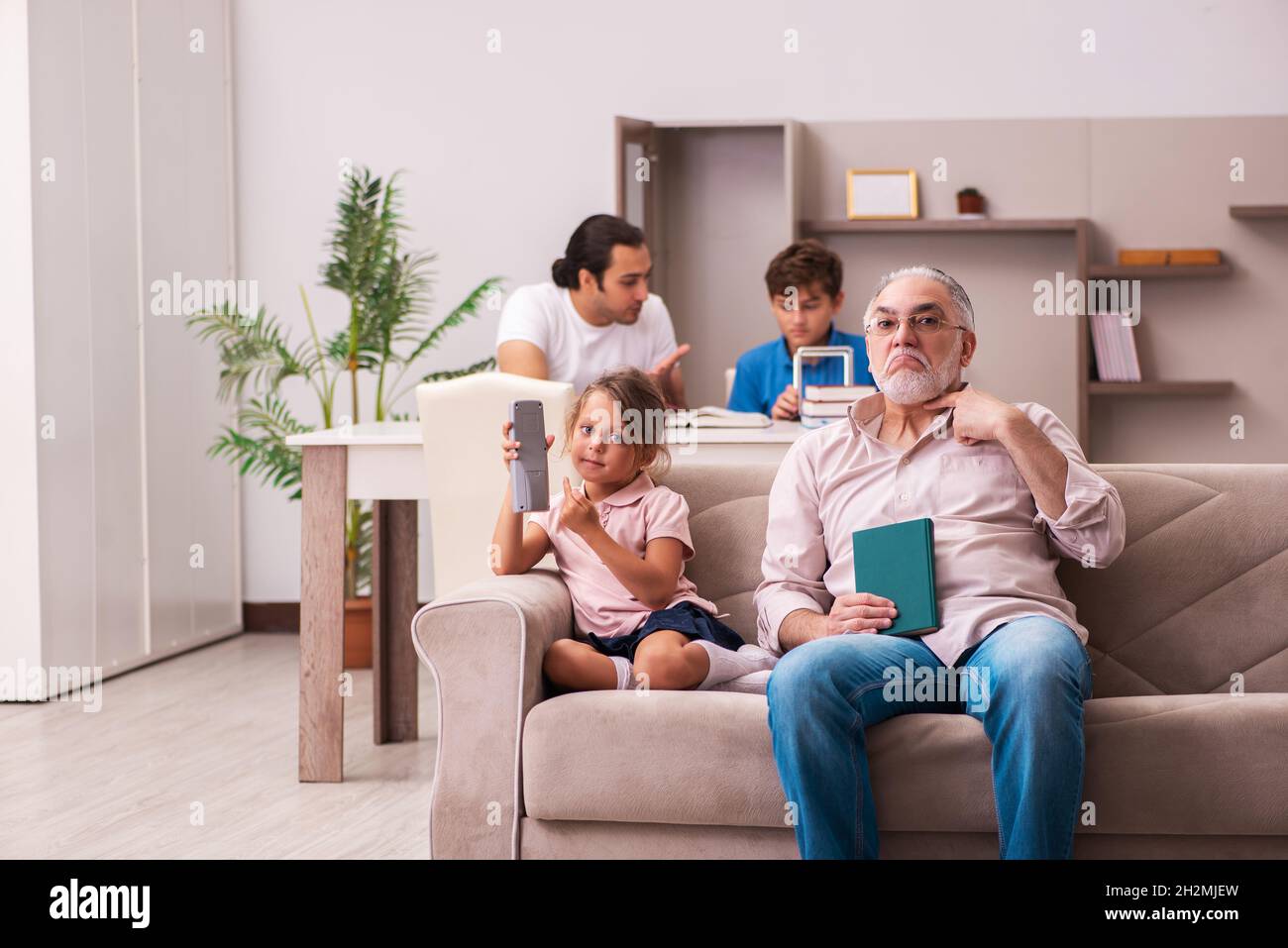 Three generations at home in early development concept Stock Photo - Alamy