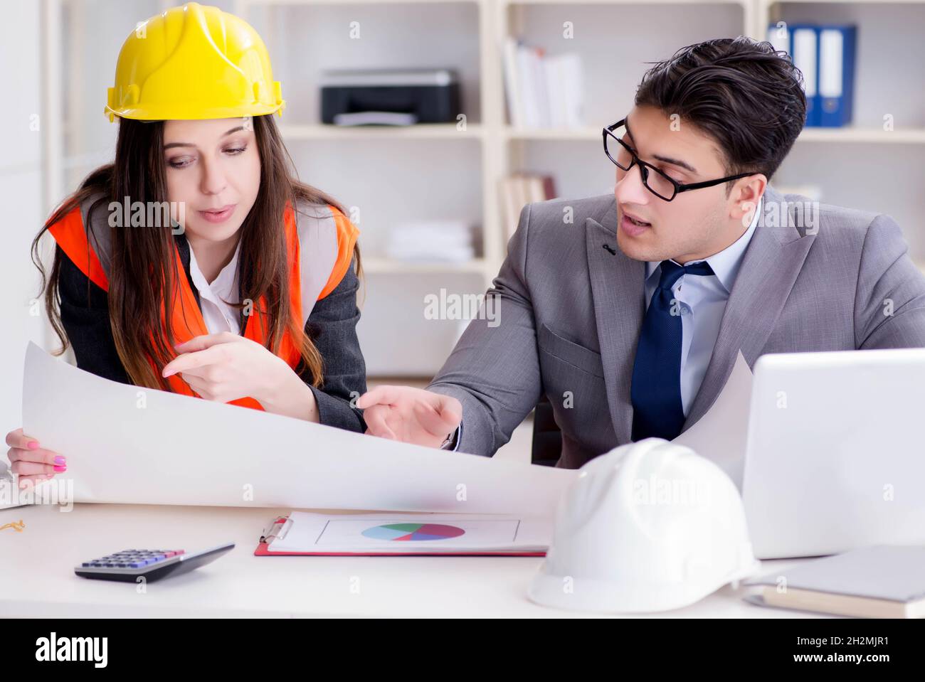 Reviewing architectural drawings hi-res stock photography and images ...