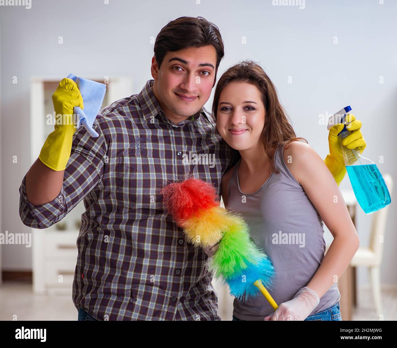 The wife and husband doing cleaning at home Stock Photo - Alamy