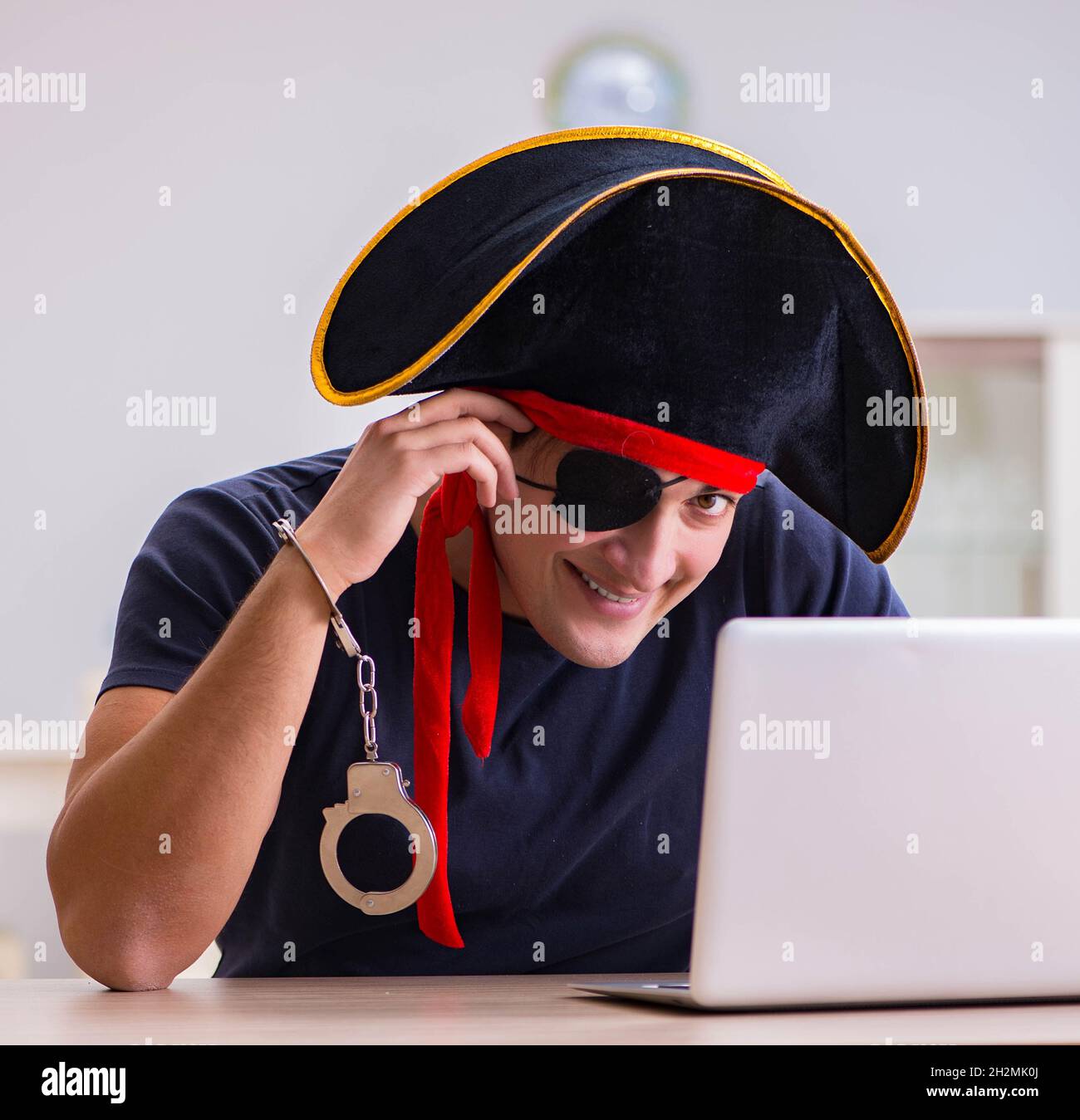 The digital security concept with pirate at computer Stock Photo - Alamy