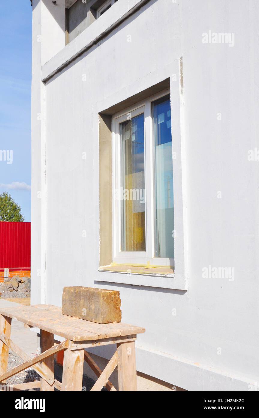 New Installed White Plastic Window with Plastered and Painted New House ...