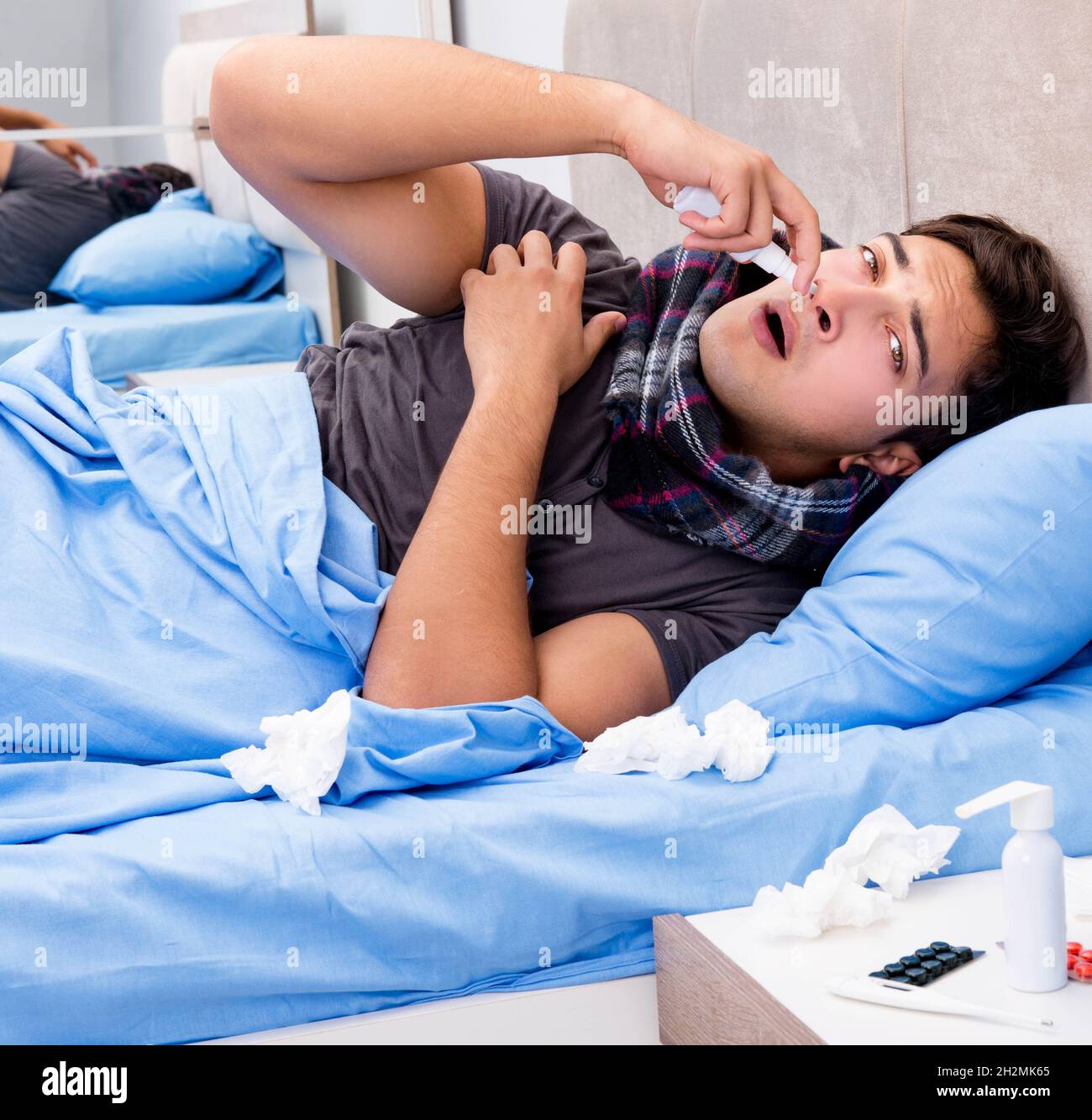 The sick ill man in the bed taking medicines and drugs Stock Photo - Alamy