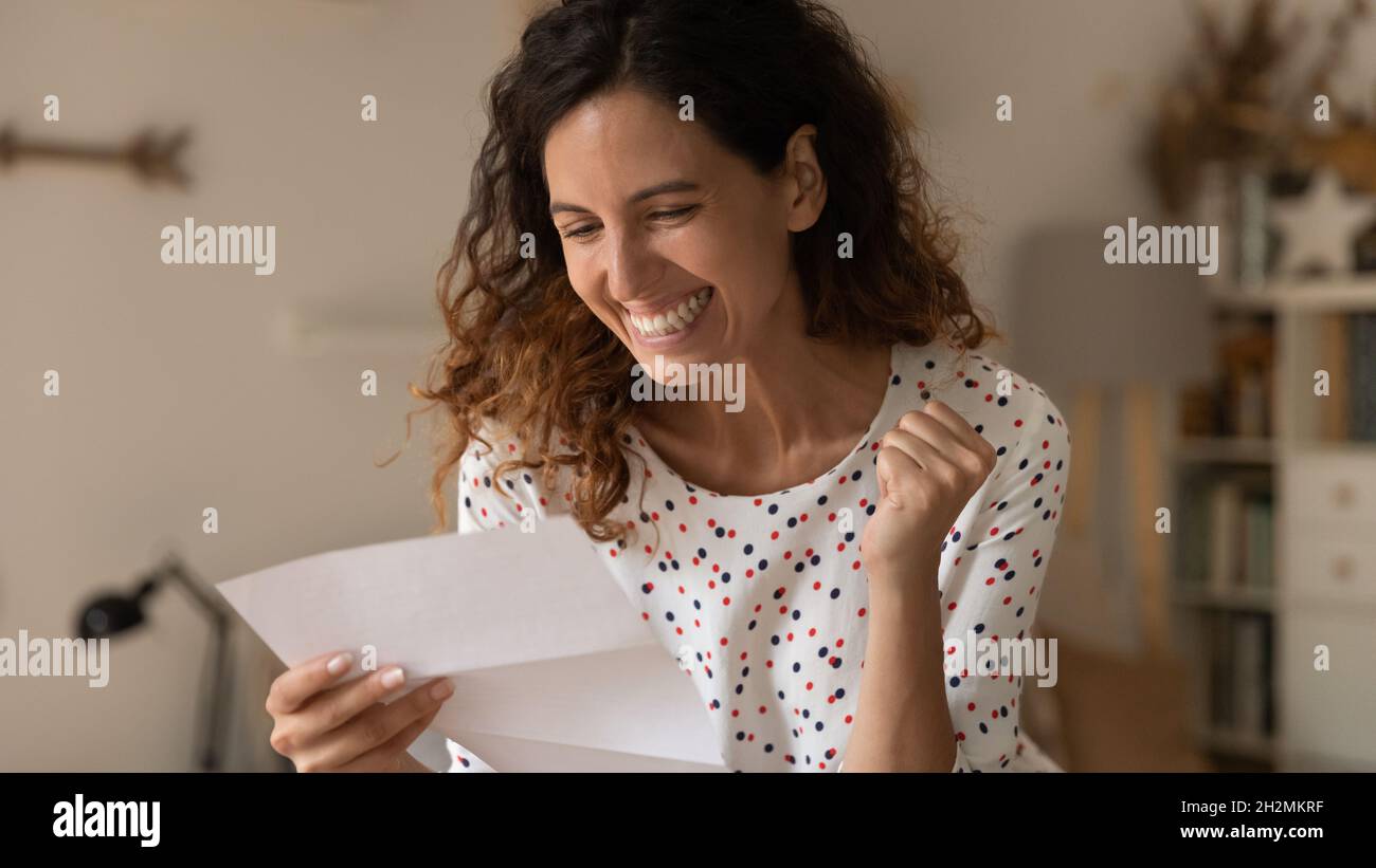 Happy excited woman reading paper letter, getting unbelievable good ...