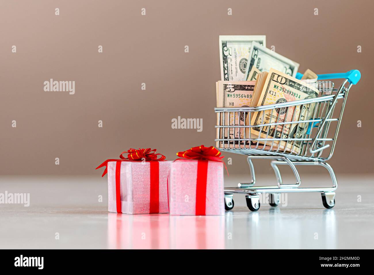 Christmas expense planning concept , gift boxes and shopping cart full ...