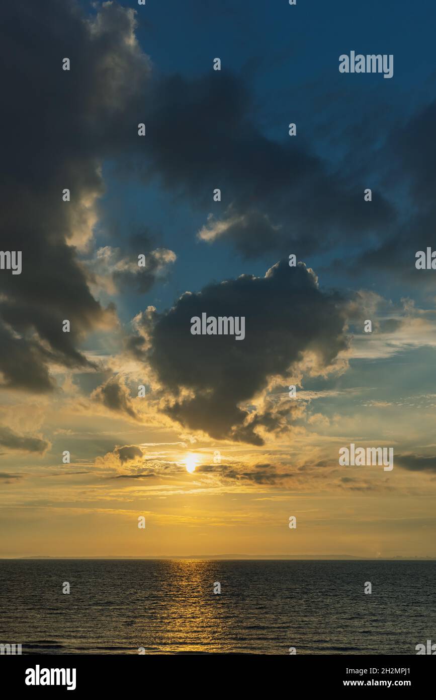 Streak of sunlight going across the channel as the setting sun lights ...